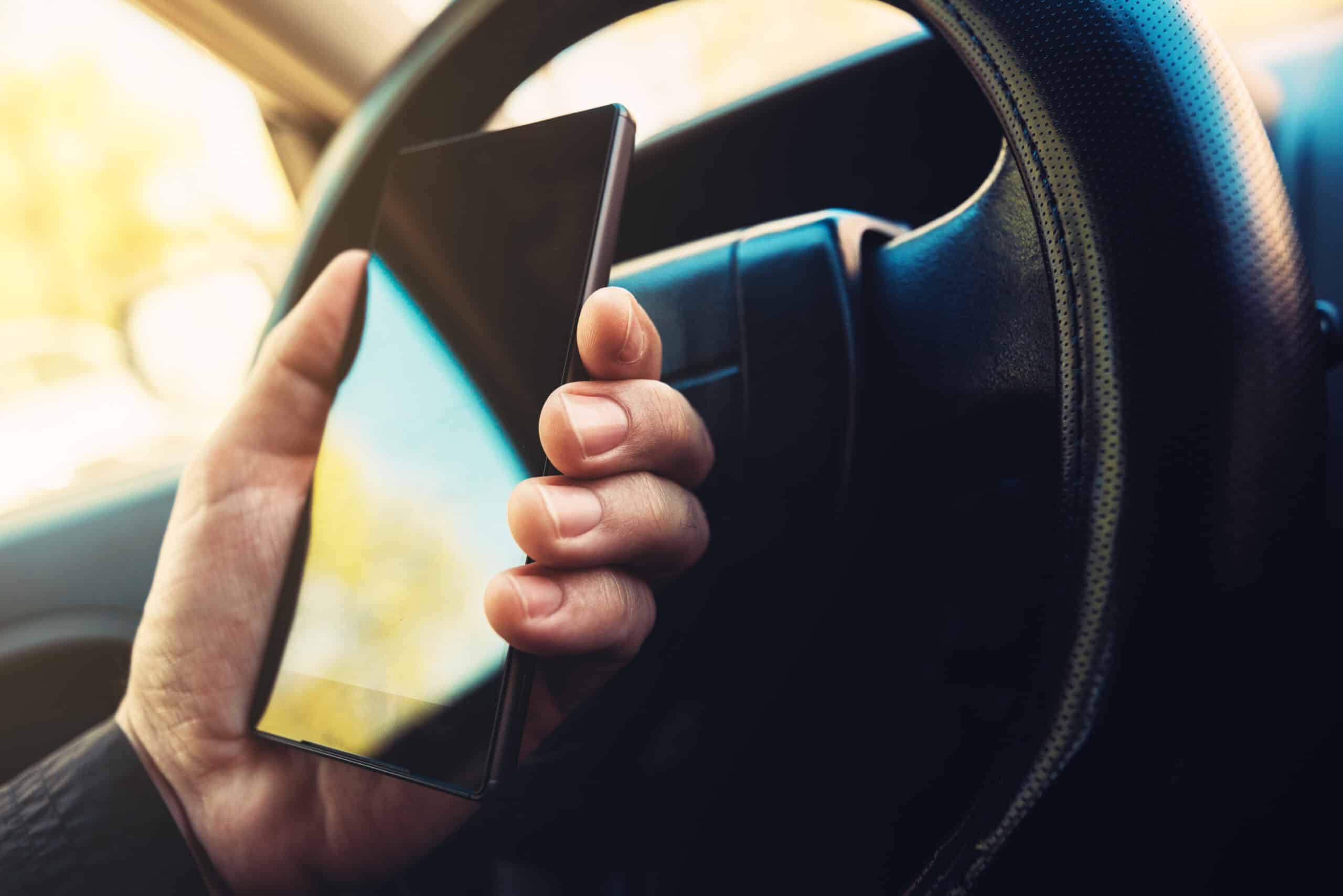 New law set to make all mobile phone use while driving illegal ...